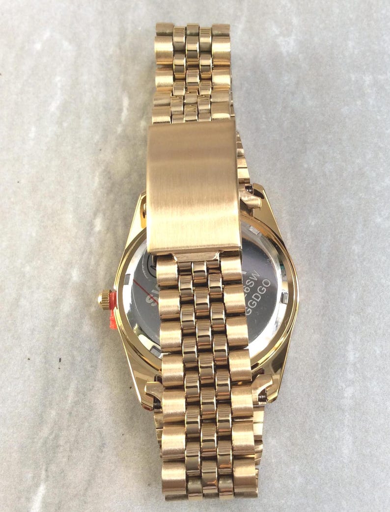 SWANSON Men's Gold Watch Round Gold Accented Dial Displaying Gold Index ...