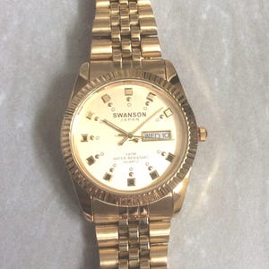 SWANSON Men's Gold Watch Round Gold Dial Unique Hour Markers Day & Date ...