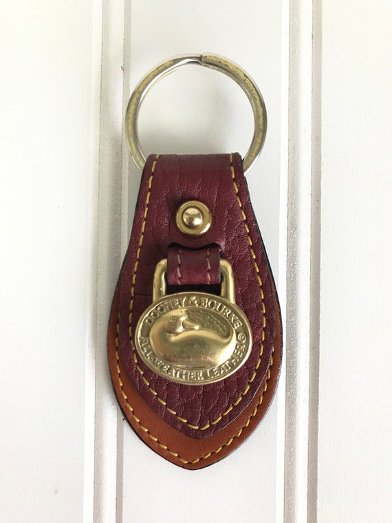 Dooney & bourke brass - Gem