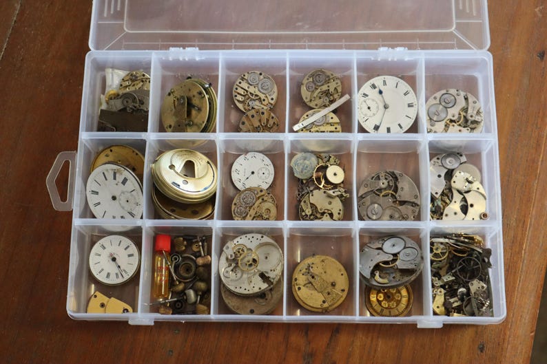 Collection of Antique Pocket Watch Movements and Parts With Plastic ...