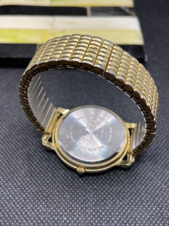 Vintage LTD Gold Tone ladies stretch band watch. - Gem