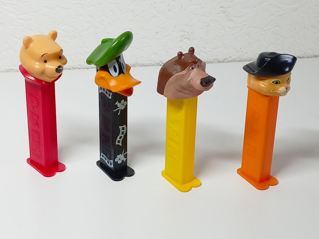Pez Dispensers With Daffy Duck, Winnie the Pooh, Taz, Puss in Boots ...