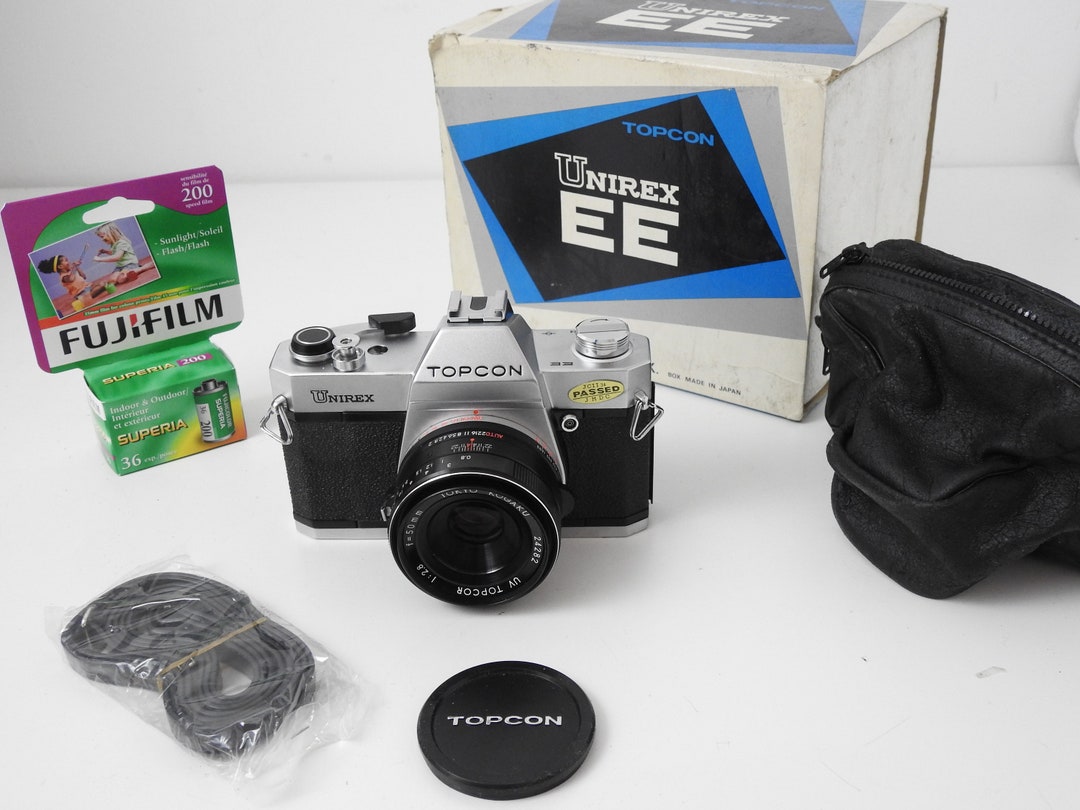 Mint TOPCON Unirex EE S.L.R Film Camera With 50mm F:2.8 Lens in Box Case Strap Roll of Color ...