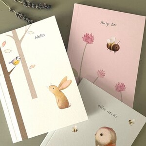 A6 96pp Notebook Featuring Two Cute Ladybirds Sitting on Top of Forget ...