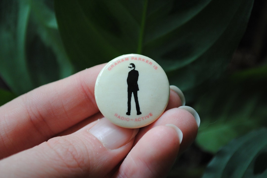 Vintage Graham Parker is Radioactive Pin Back Button - Rock New Wave ...