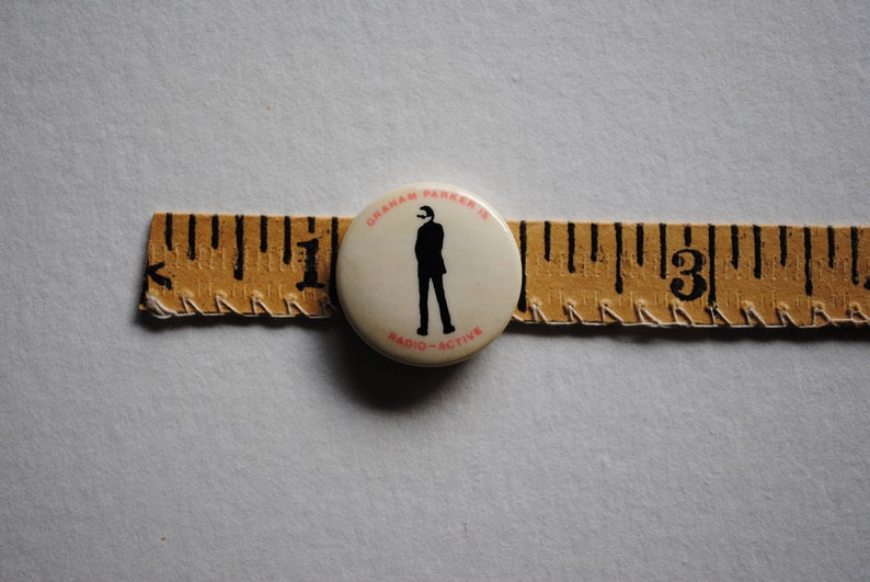 Vintage Graham Parker is Radioactive Pin Back Button - Rock New Wave ...