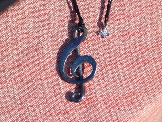 Hand forged treble clef pendant | Etsy
