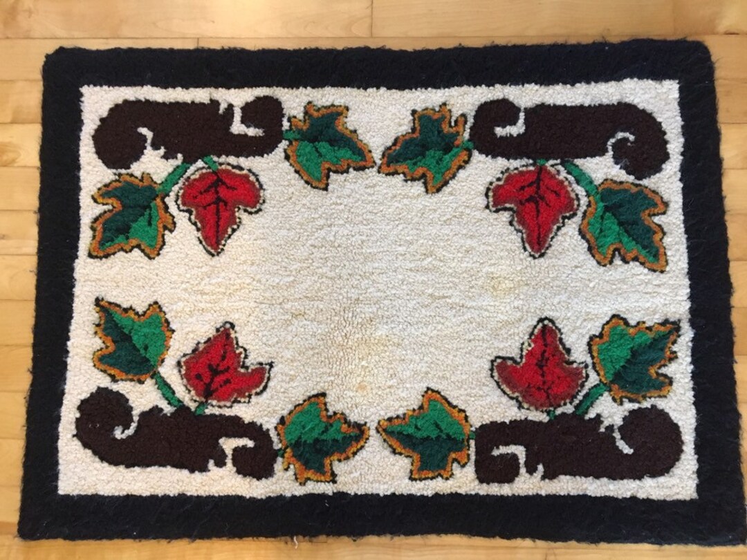 A Hand Hooked Maple Leaf Pattern Rug With a Slight Discoloring of the ...
