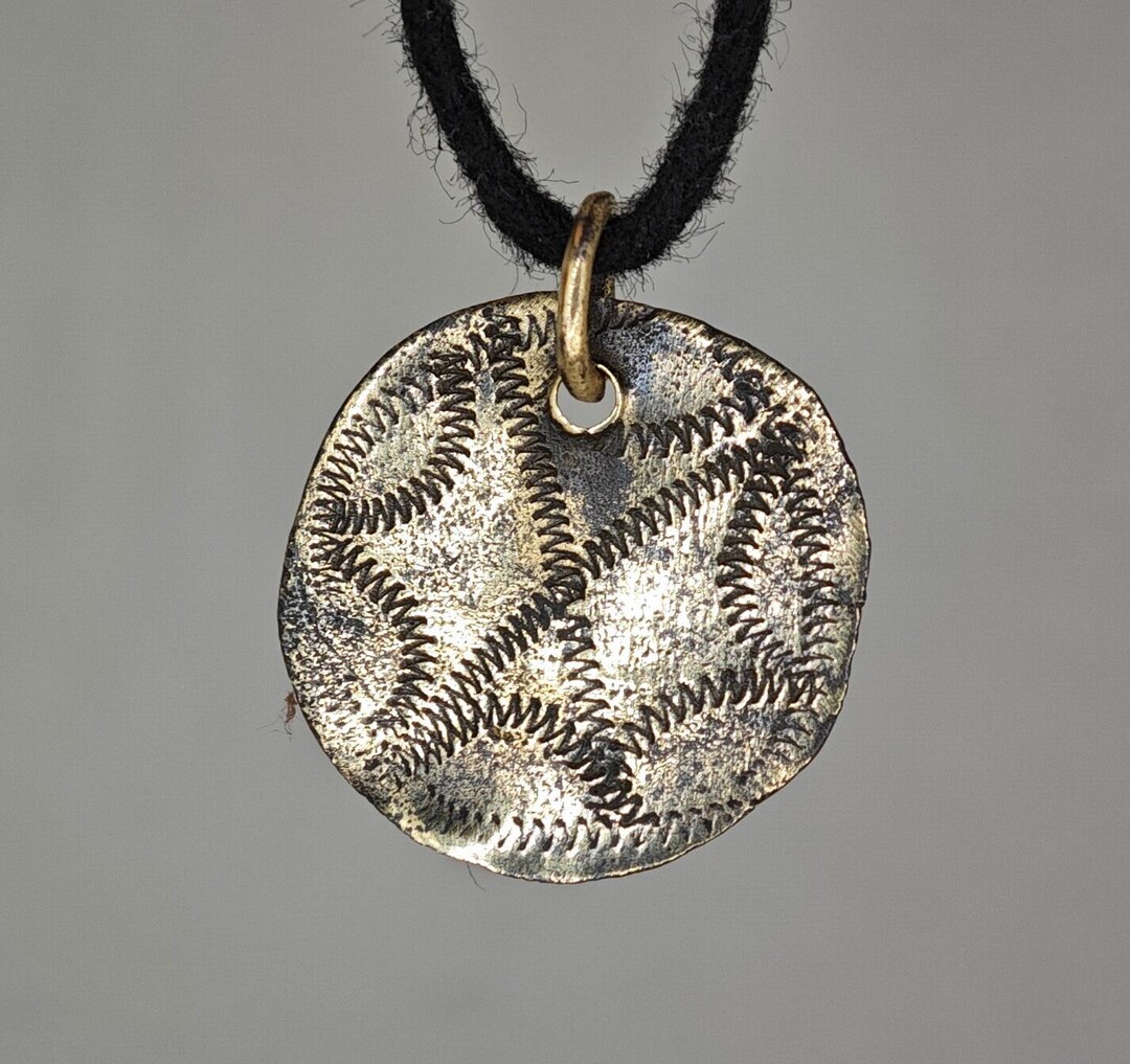 Ancient Medieval Amulet With a Sun. an Ancient Amulet. Antique Pendant ...