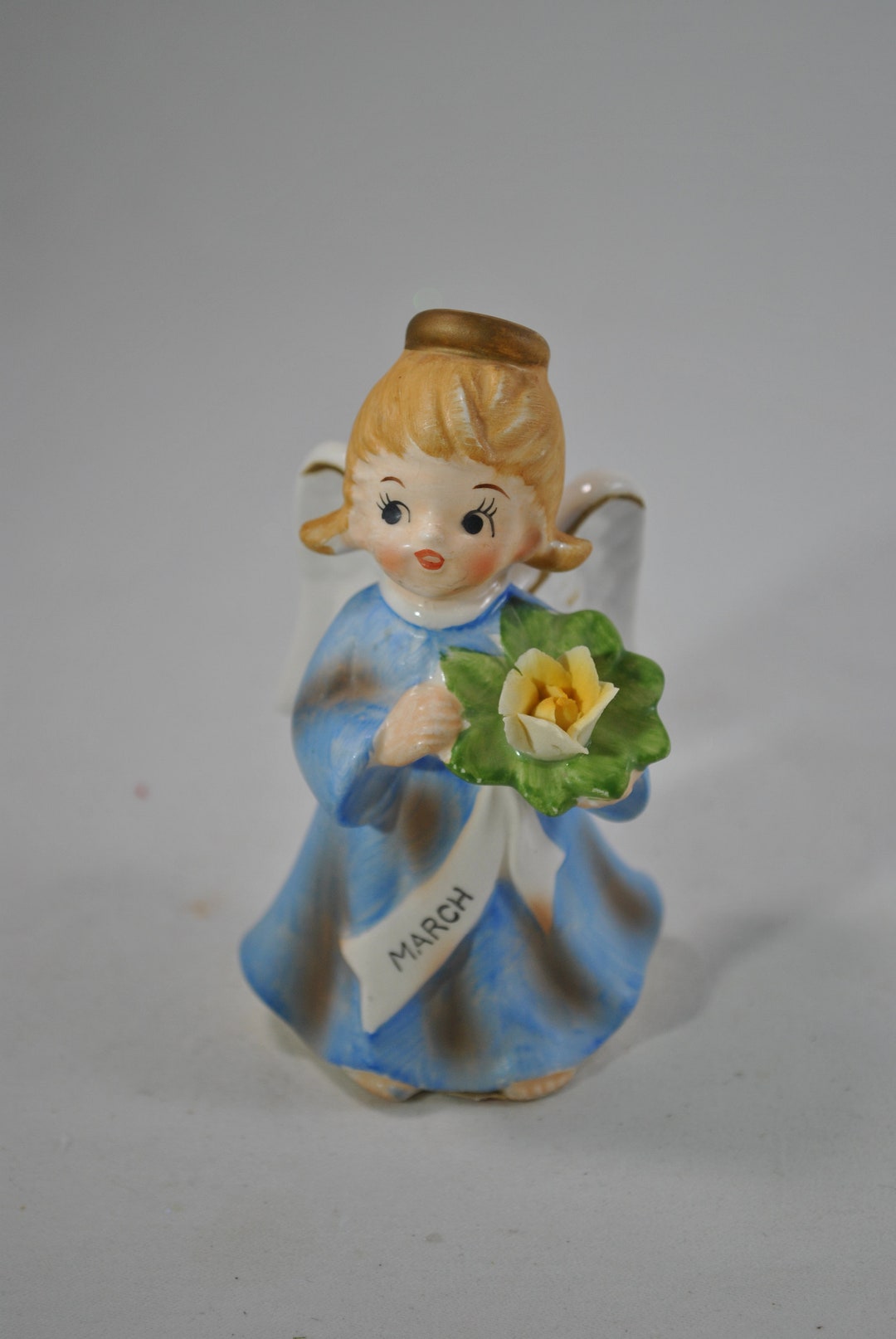 Lefton March Angel in a Blue Dress With White Sash and Big Yellow ...