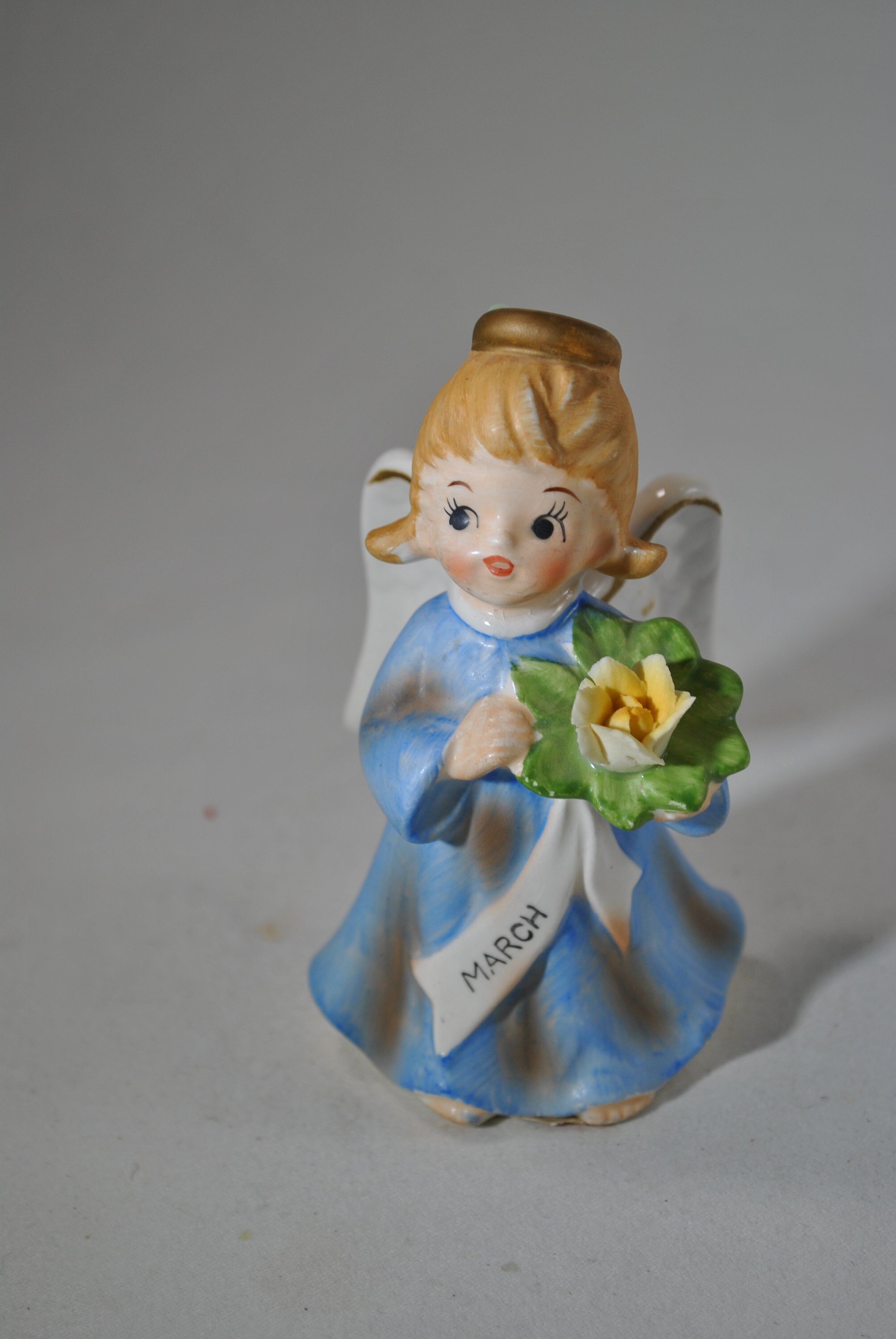 Lefton March Angel in a Blue Dress With White Sash and Big Yellow ...