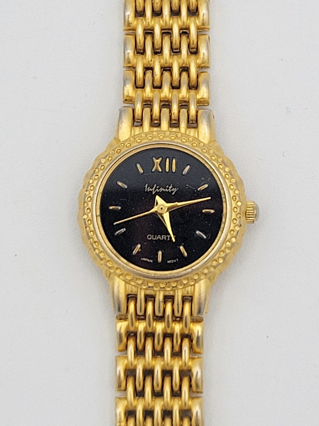 Vintage Infinity Gold Tone Round Ladies Bracelet Watch With Black Face ...