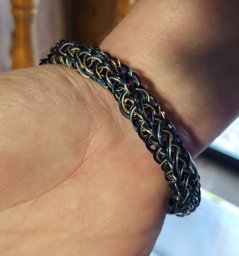 Beautiful Braided Wire Bracelet With Gold Tone End Caps and Jesse James ...