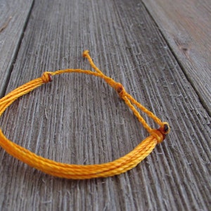 Stackable String Bracelet | Adjustable and Waterproof | Golden Yellow ...