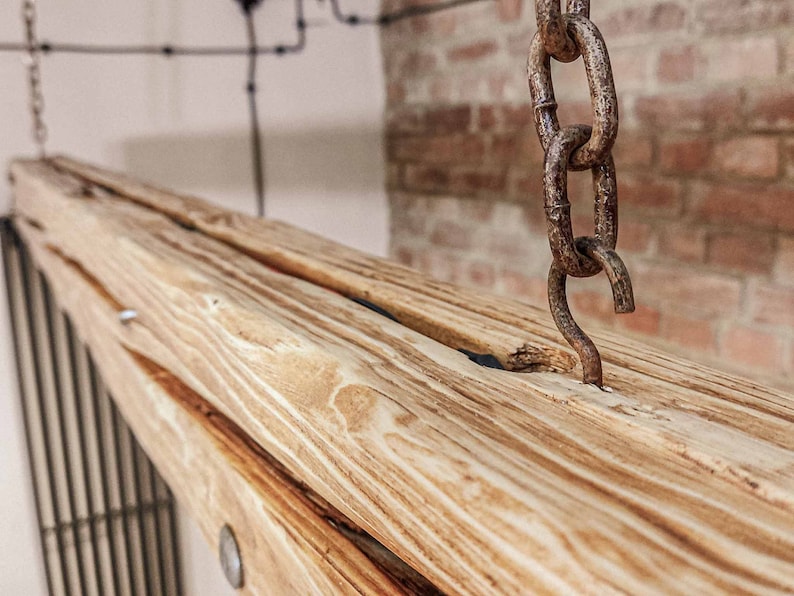 Long Wooden Beam Lamp Hanging on Chains in Rustic Style. Natural Light ...