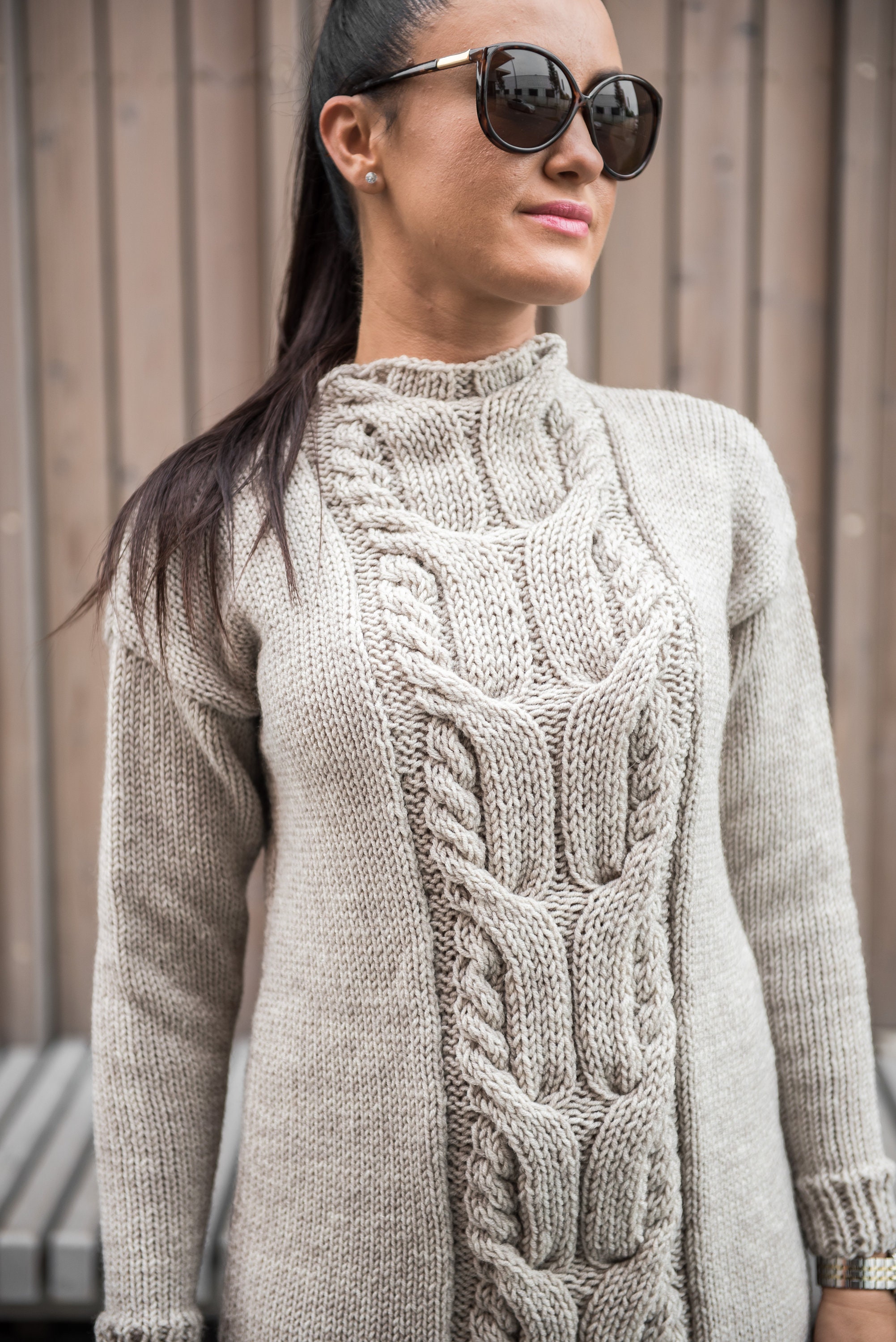 Chunky knit sweater dress for women with a big cable in front of it ...