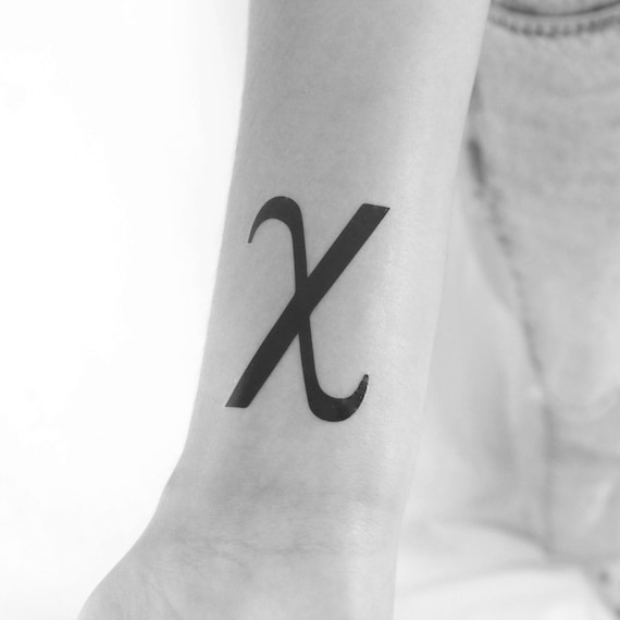 Chi Symbol Tattoos Chinese Symbol Tattoo On The Back Of A Young Woman