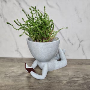 Laying People Planter Book Reader With Crossed Legs | Relaxed Pose With ...