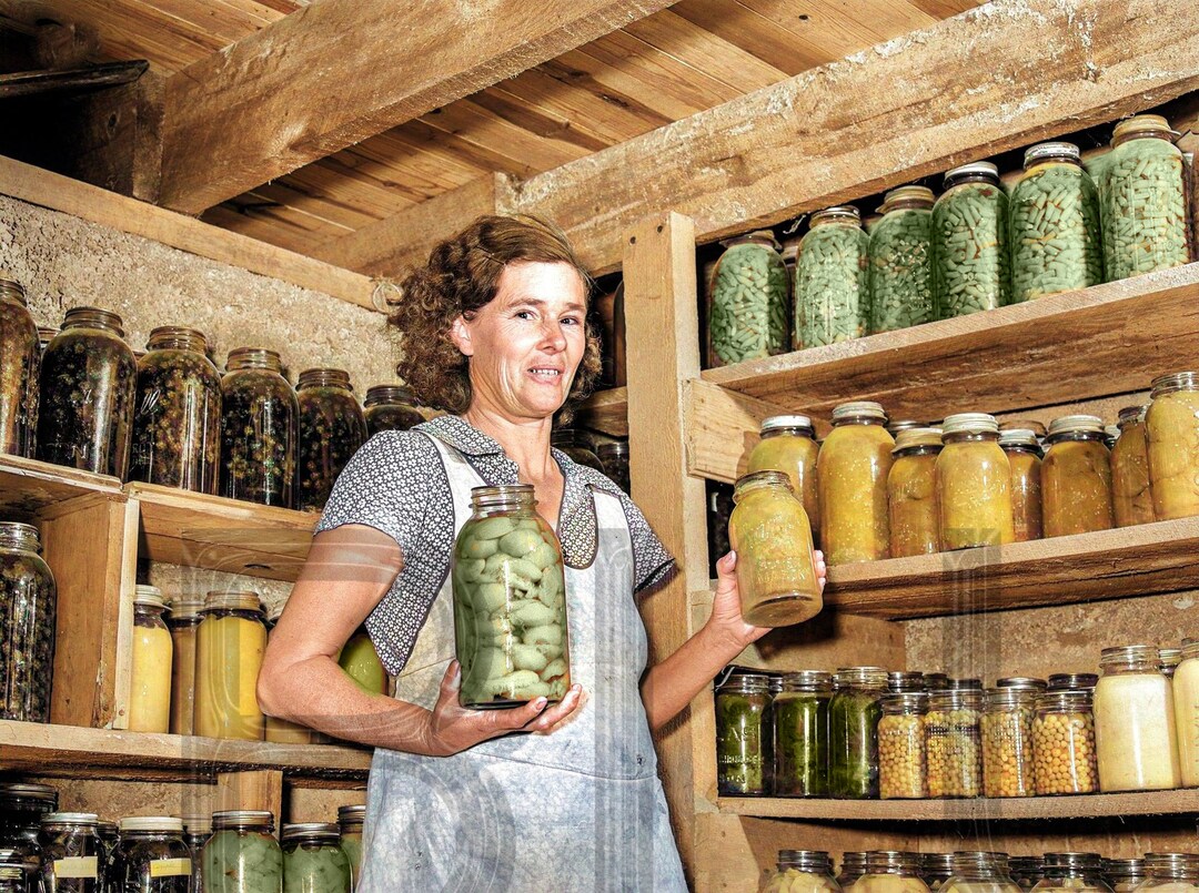 1939 Wife of Tiff Miner, With Some of Her 800 Quarts of Food Canned ...