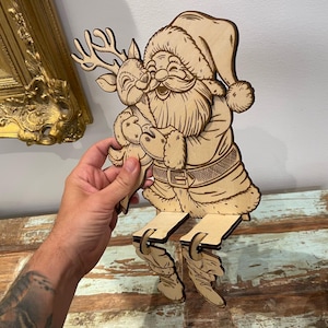 Cut Santa Hugging Rudolph Reindeer SVG File Ready for the Holidays DIY ...