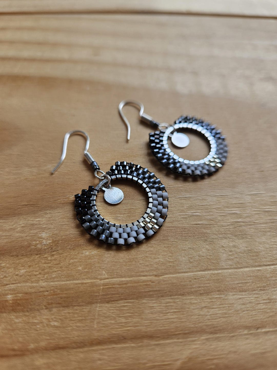 Linel | Creole Earrings With Woven Glass Beads in Shades of Gray and ...