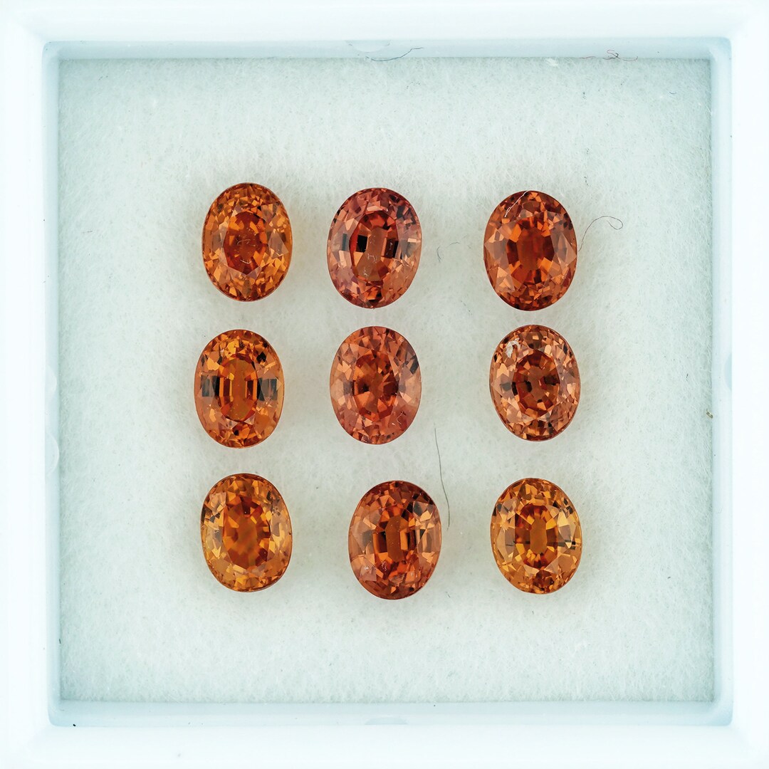 A Box of Orange, Olive Green Oval Shape Sapphires 9 Pcs, 4.2X3.2 Mm (±0 ...