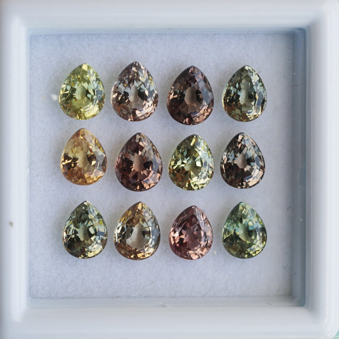 A Box of Mixed Shade of Green and Brown Pear Shape Sapphires 12 Pcs ...