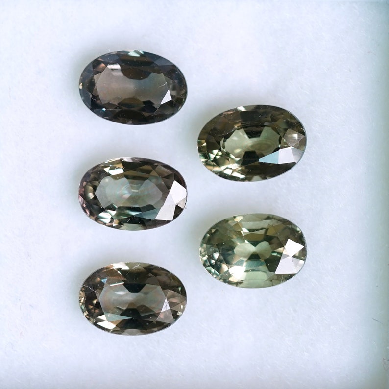 A Box of Mixed Natural Dark Olive Green Oval Shape Sapphires 5 Pcs, 6 ...