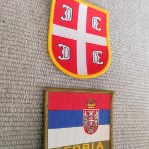 The Military Insignia of a Serbian Soldier and the Flag of Serbia Worn on the Uniform of a ...