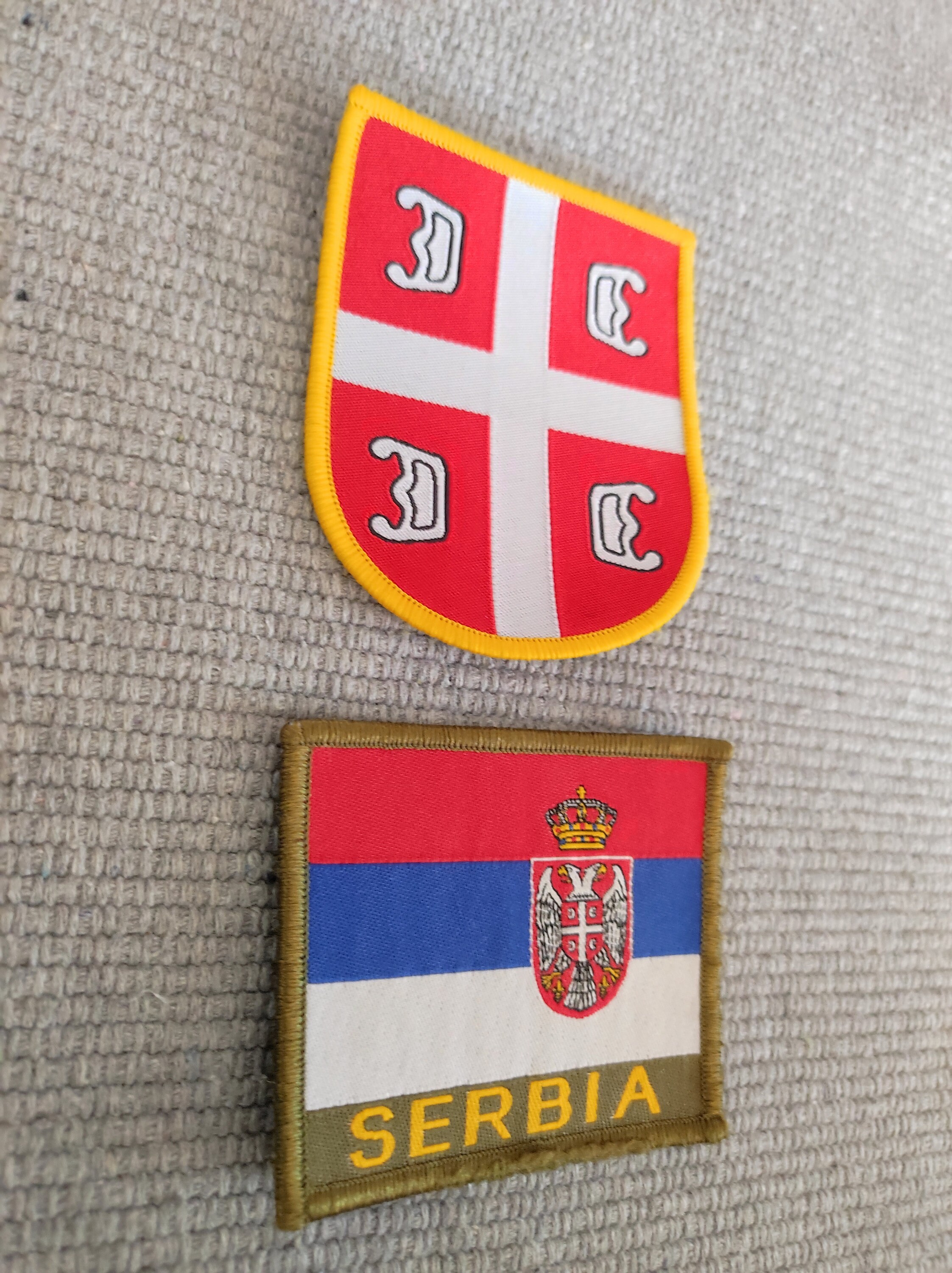 The Military Insignia of a Serbian Soldier and the Flag of Serbia Worn ...