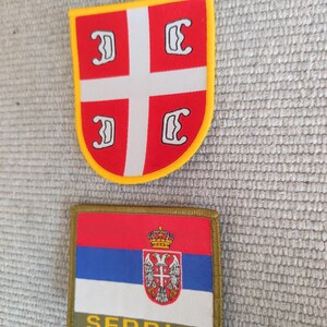The Military Insignia of a Serbian Soldier and the Flag of Serbia Worn on the Uniform of a ...