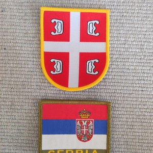 The Military Insignia of a Serbian Soldier and the Flag of Serbia Worn on the Uniform of a ...