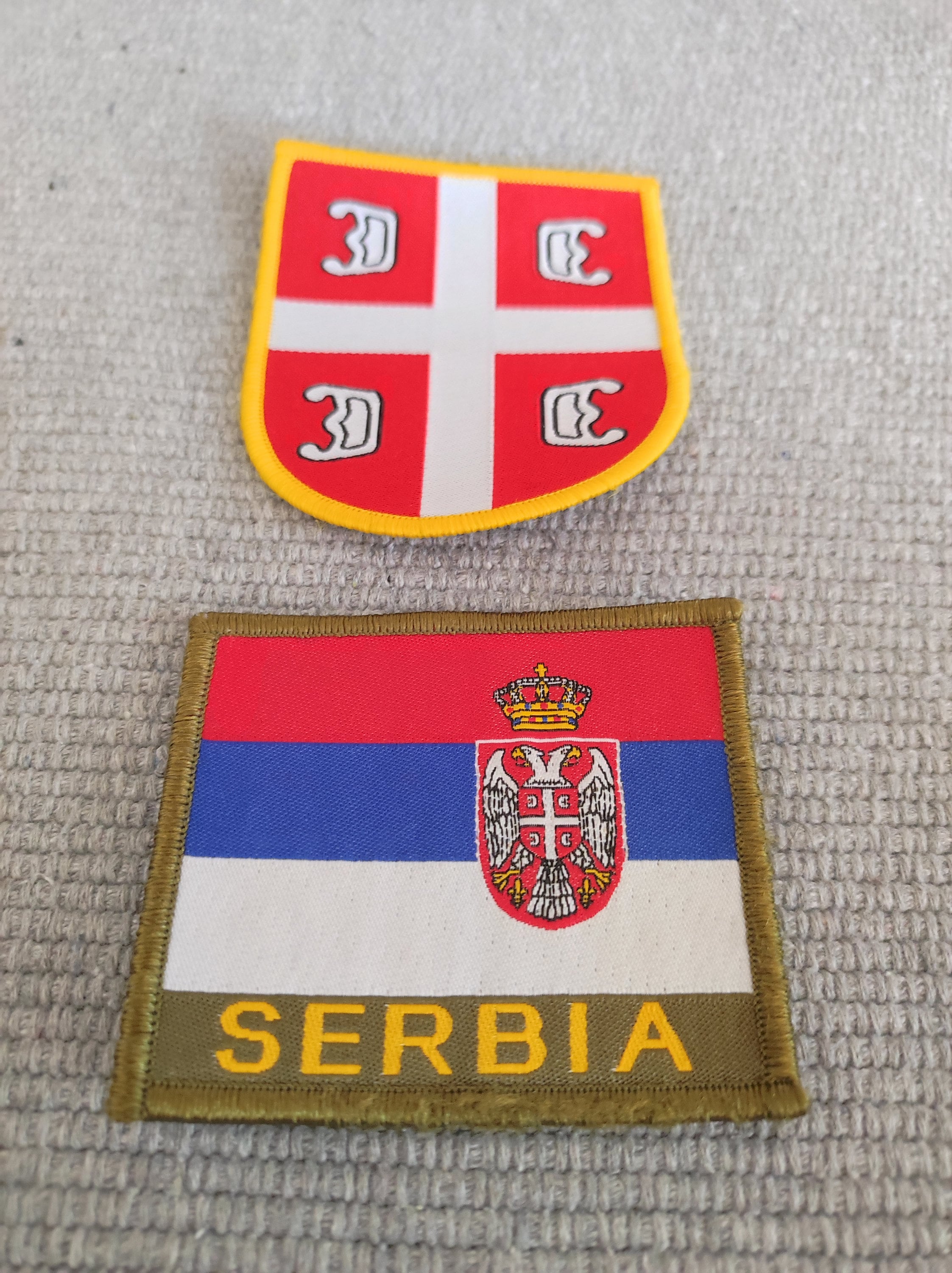 The Military Insignia of a Serbian Soldier and the Flag of Serbia Worn ...