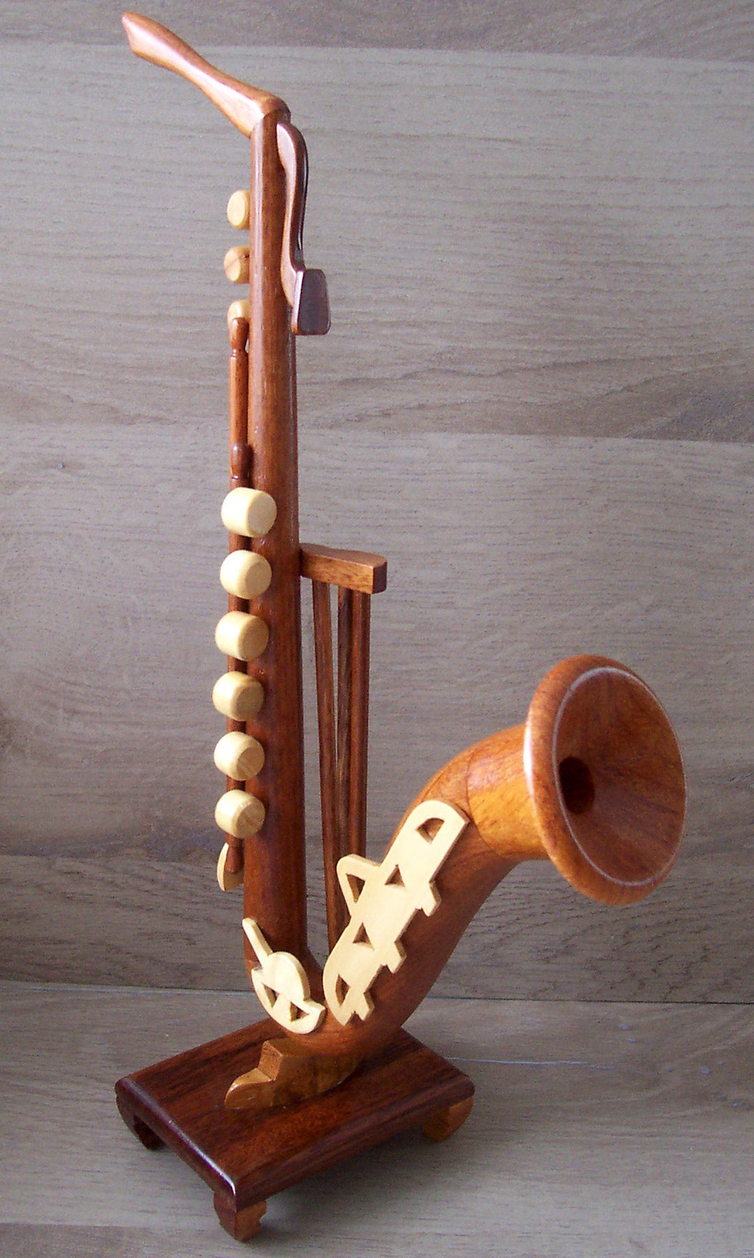 Varnished Wooden Model of the Saxophone With Its Stand for Instrument ...