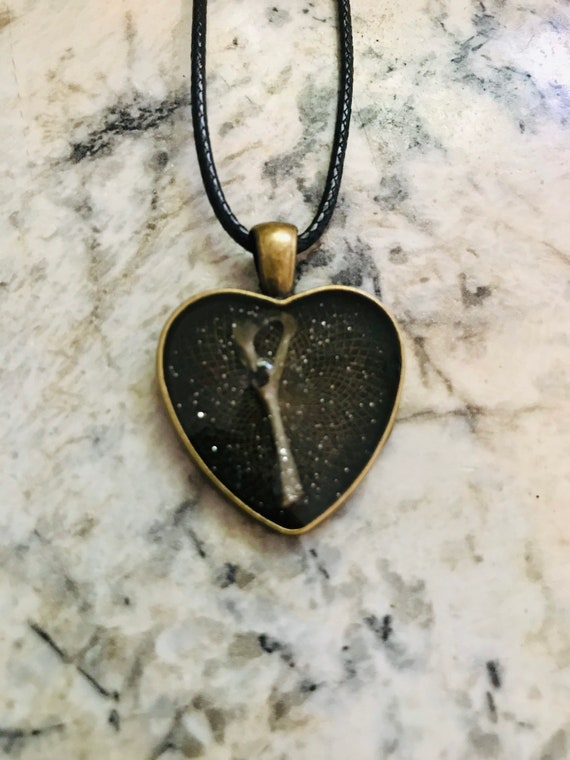 Heart and Bone Pendant Necklace | Etsy