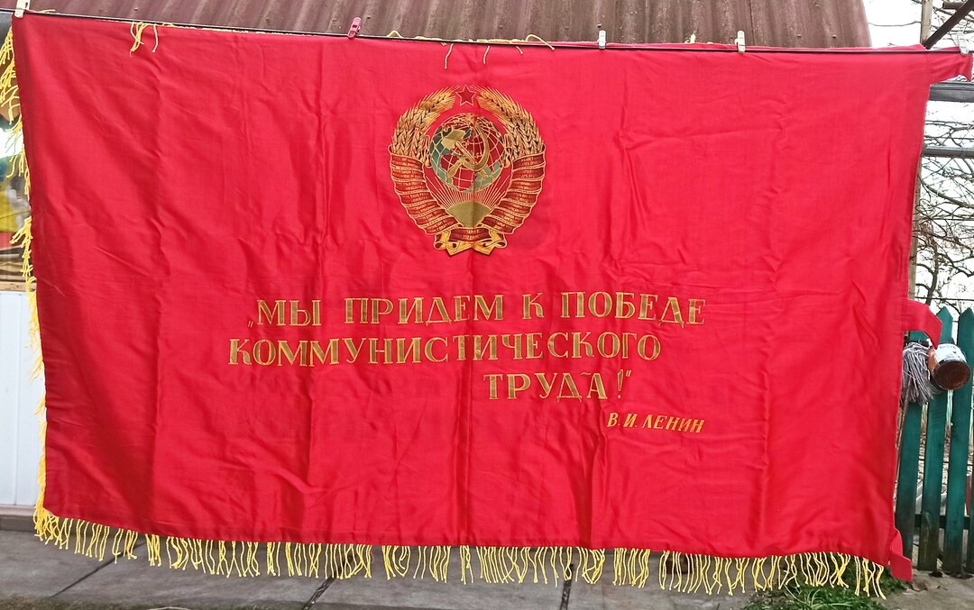 The Old State Flag of the USSR With a Portrait of Lenin and Karl Marx ...
