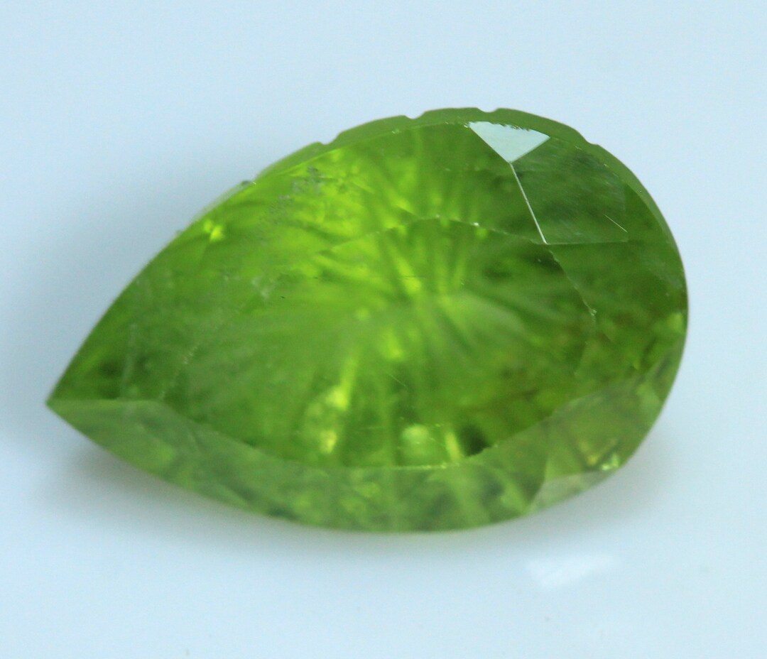 3.87 Carats Natural Peridot Carving. 12x8 MM Pear Shape. Green Color ...