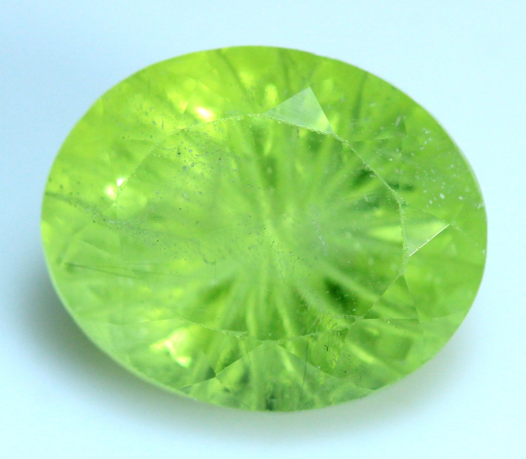 4.38 Carats Natural Peridot Carving. 11x9 MM Oval Shape. Green Color ...