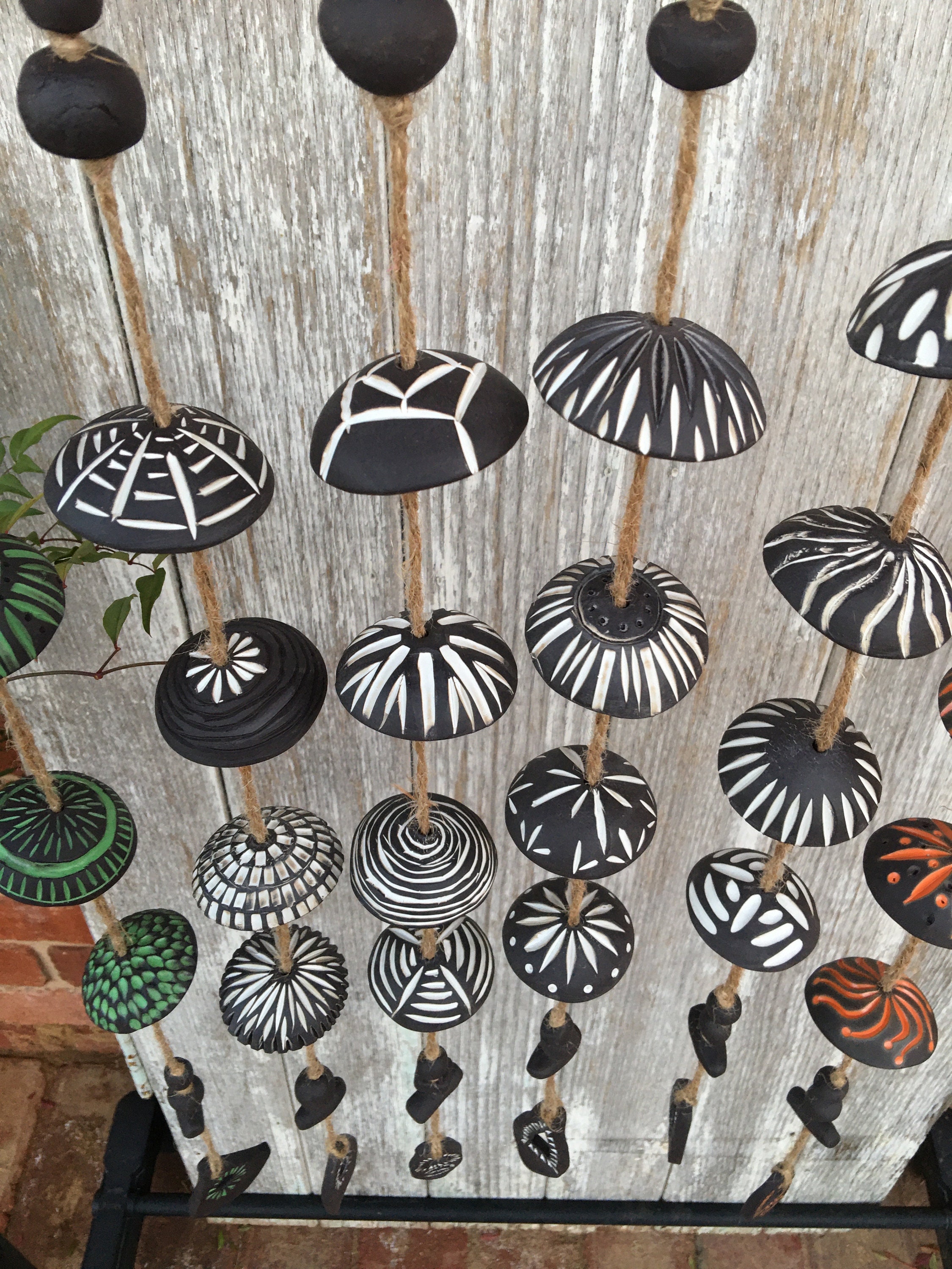 Pottery Wind Chime. Elegant Black Clay, White Cavings, Bare and Natural ...