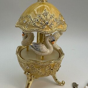 Swan Carousel Plays Swan Lake. Beautiful Scene of a Swan Taking off to ...