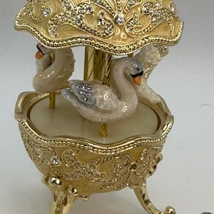 Swan Carousel Plays Swan Lake. Beautiful Scene of a Swan Taking off to ...