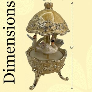 Swan Carousel Plays Swan Lake. Beautiful Scene of a Swan Taking off to ...