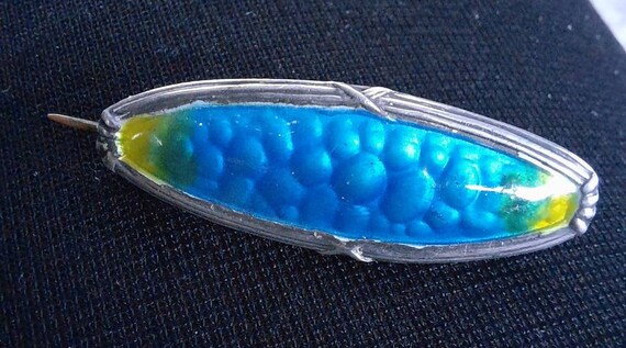 1 guilloche enamel Charles Horner style broach. - Gem