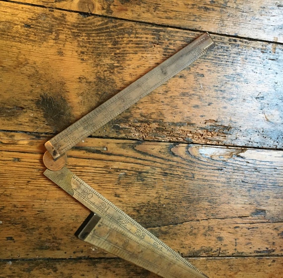 Folding measuring stick store