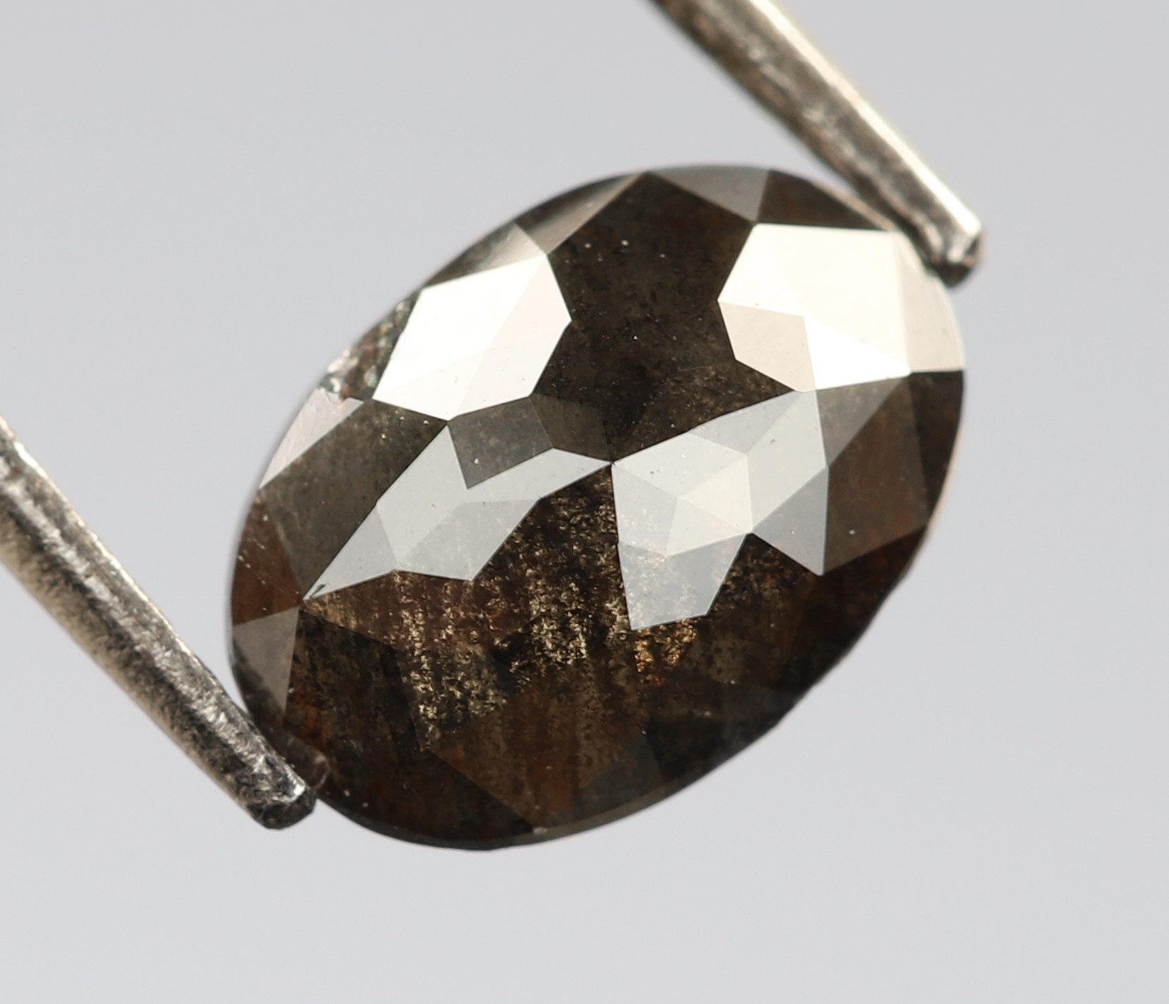 0.77 Ct, 7.0 X 4.9 X 2.6 MM, Oval Shape Brown Black Color Natural Loose ...