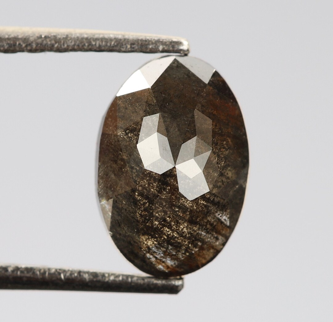 0.77 Ct, 7.0 X 4.9 X 2.6 MM, Oval Shape Brown Black Color Natural Loose ...