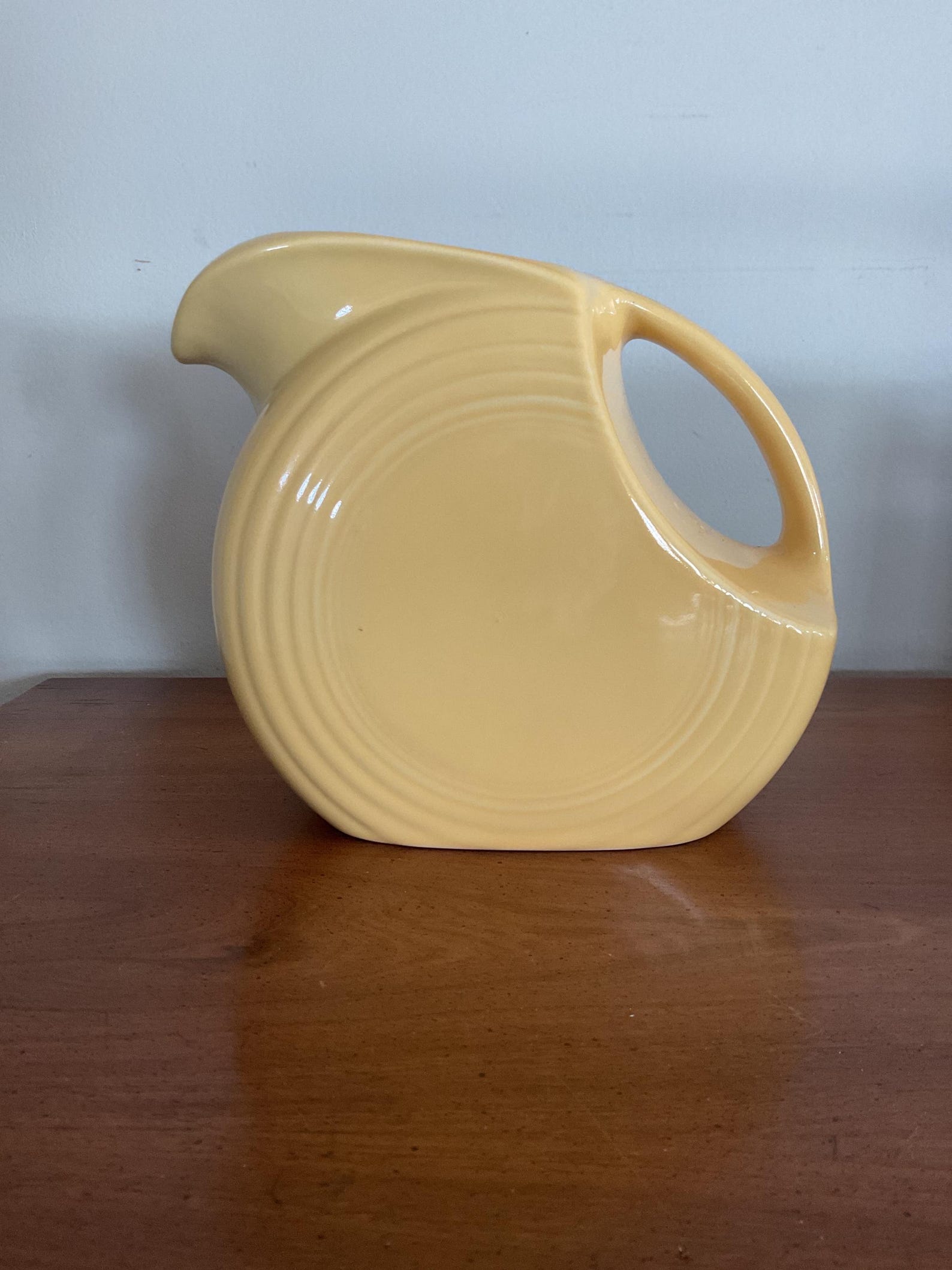 Fiestaware ( HLC ) Large Pale Yellow Disc Pitcher Embossed Script Logo ...