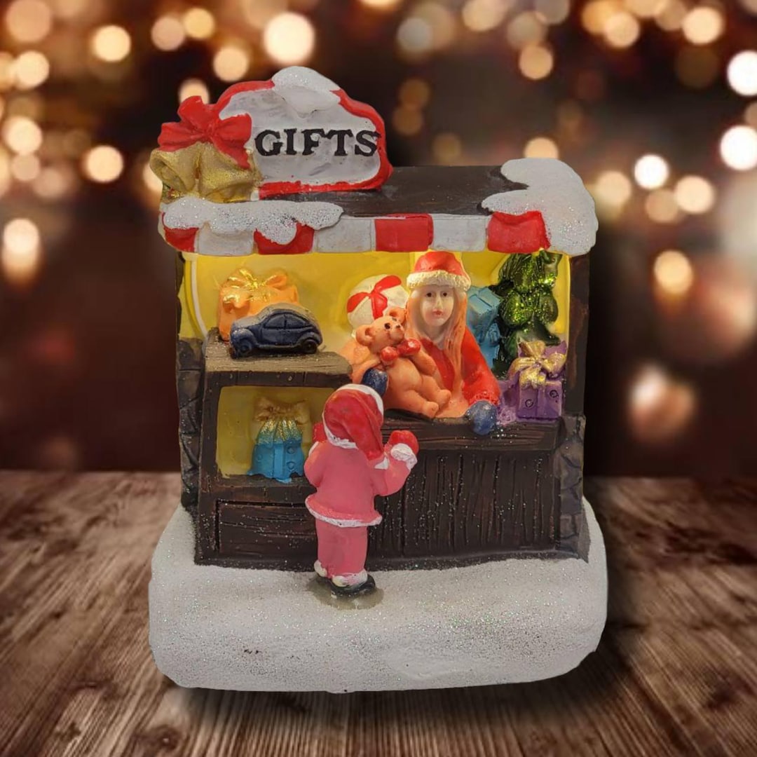 Gift Shop Scene With Holiday Decorations. Lighted Christmas Village ...