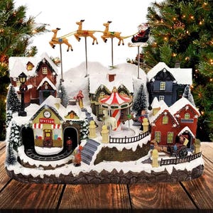 Christmas Village With Santa Sleigh & Reindeer. LED Light up Scene With ...