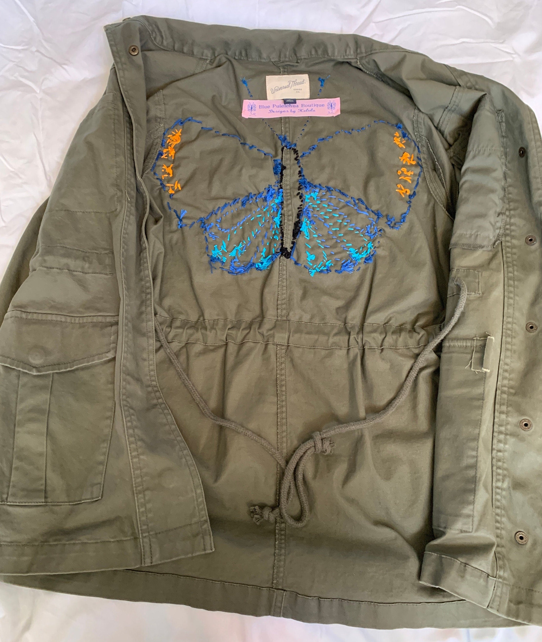 Art on Army Green Jacket. Blue Butterfly Art Created With Recycled ...